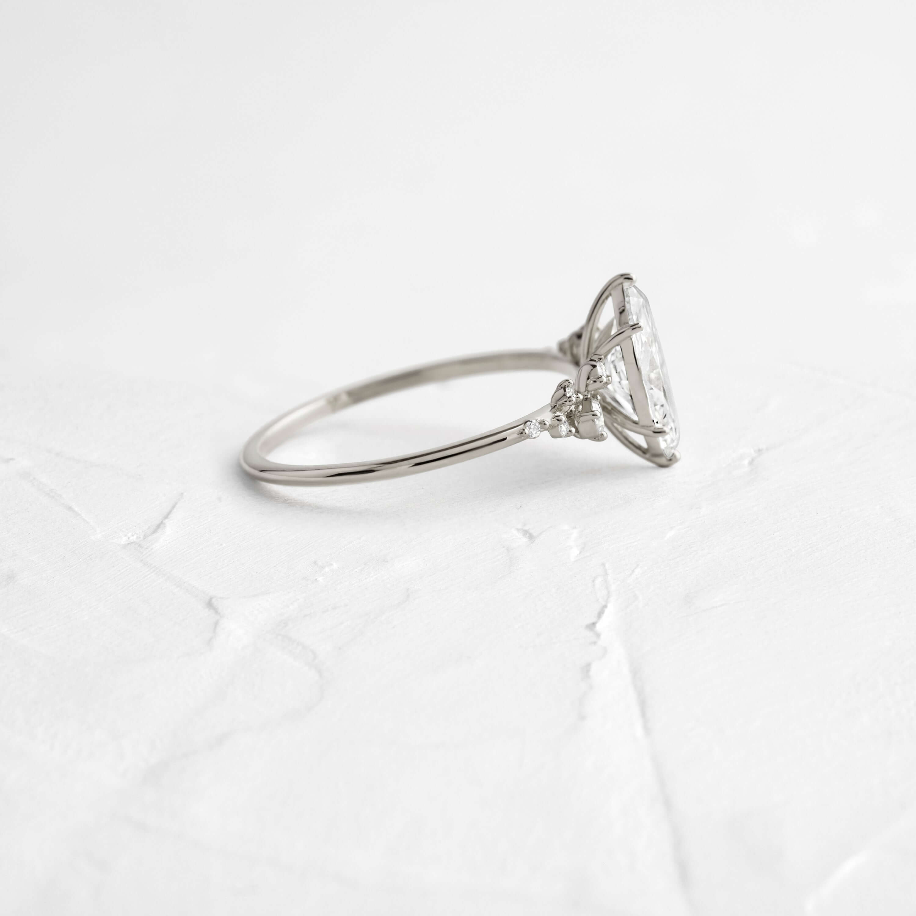 Snowdrift Ring with a Marquise Cut Diamond and Cluster Band – Melanie Casey