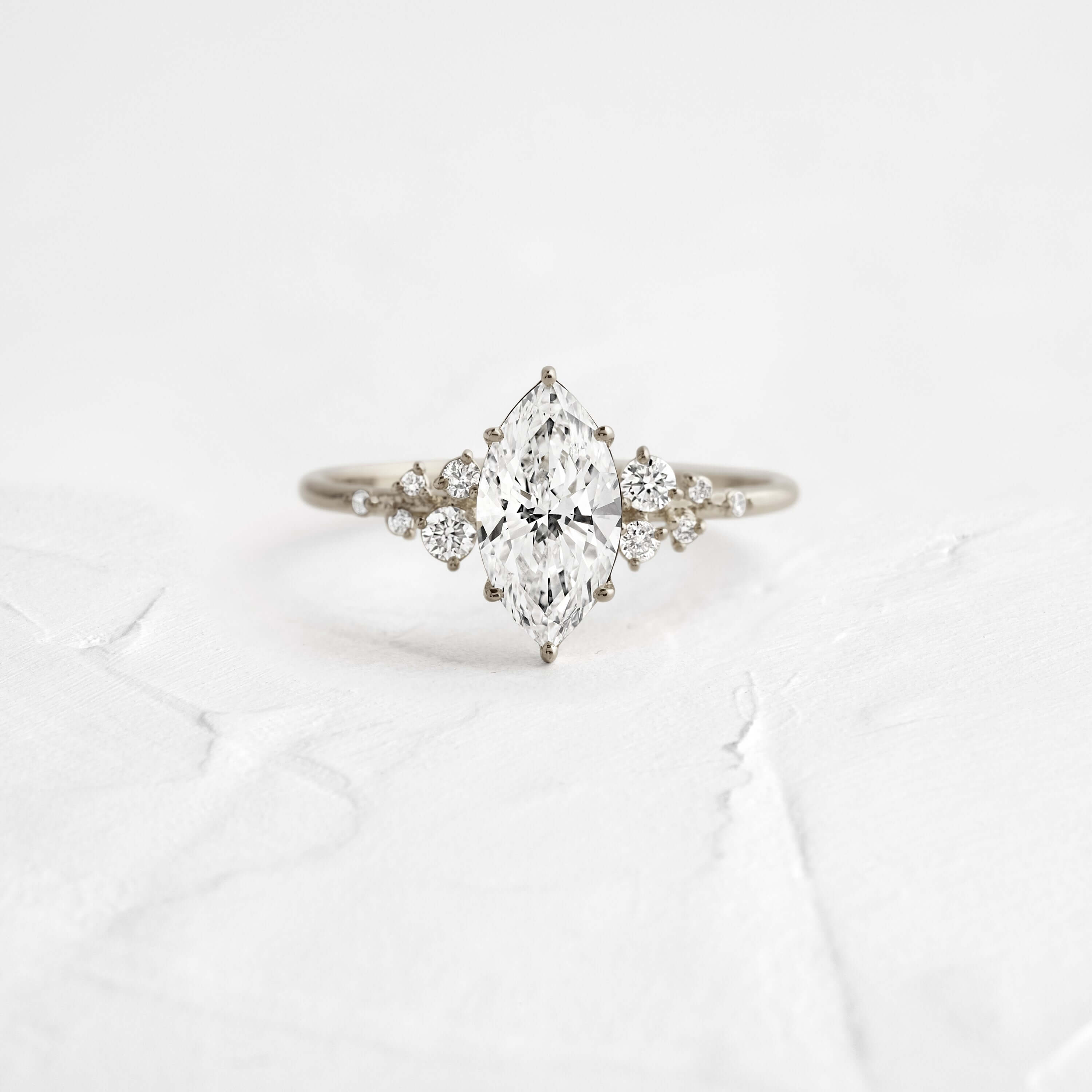 Snowdrift Ring with a Marquise Cut Diamond and Cluster Band – Melanie Casey