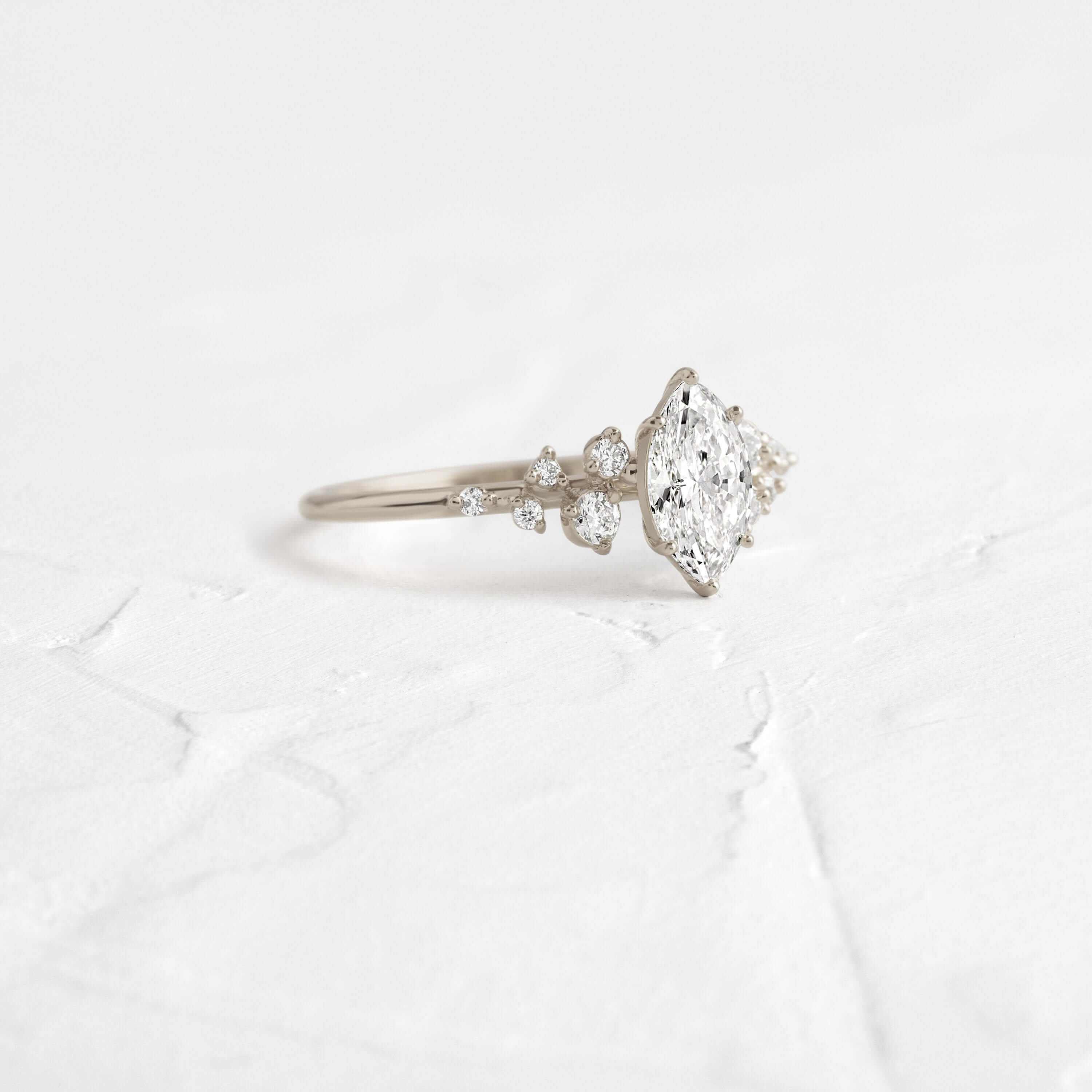 Snowdrift Ring with a Marquise Cut Diamond and Cluster Band – Melanie Casey